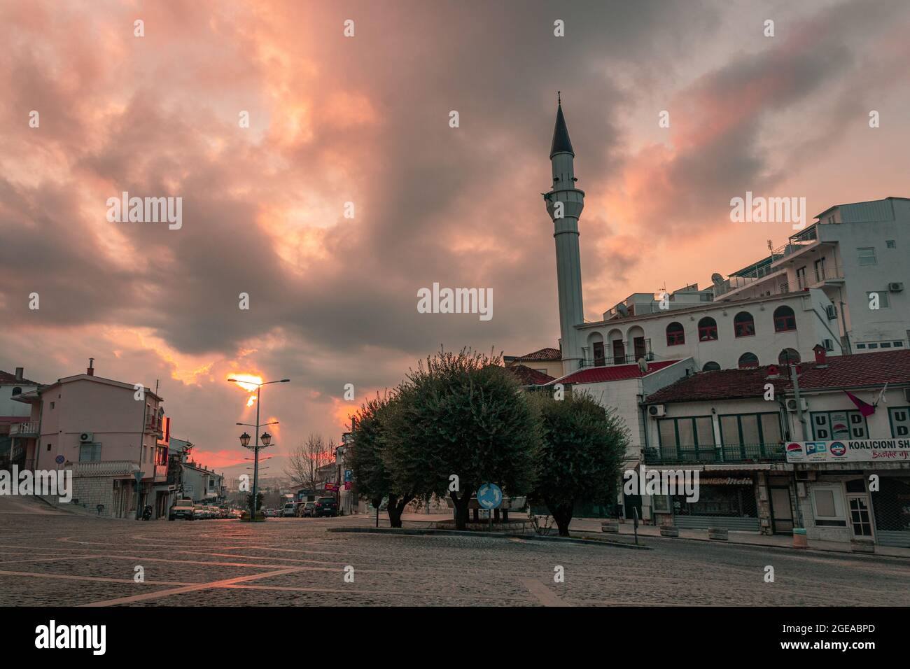 Mosque at sunrise with pink sky and olive trees in the foreground Stock ...