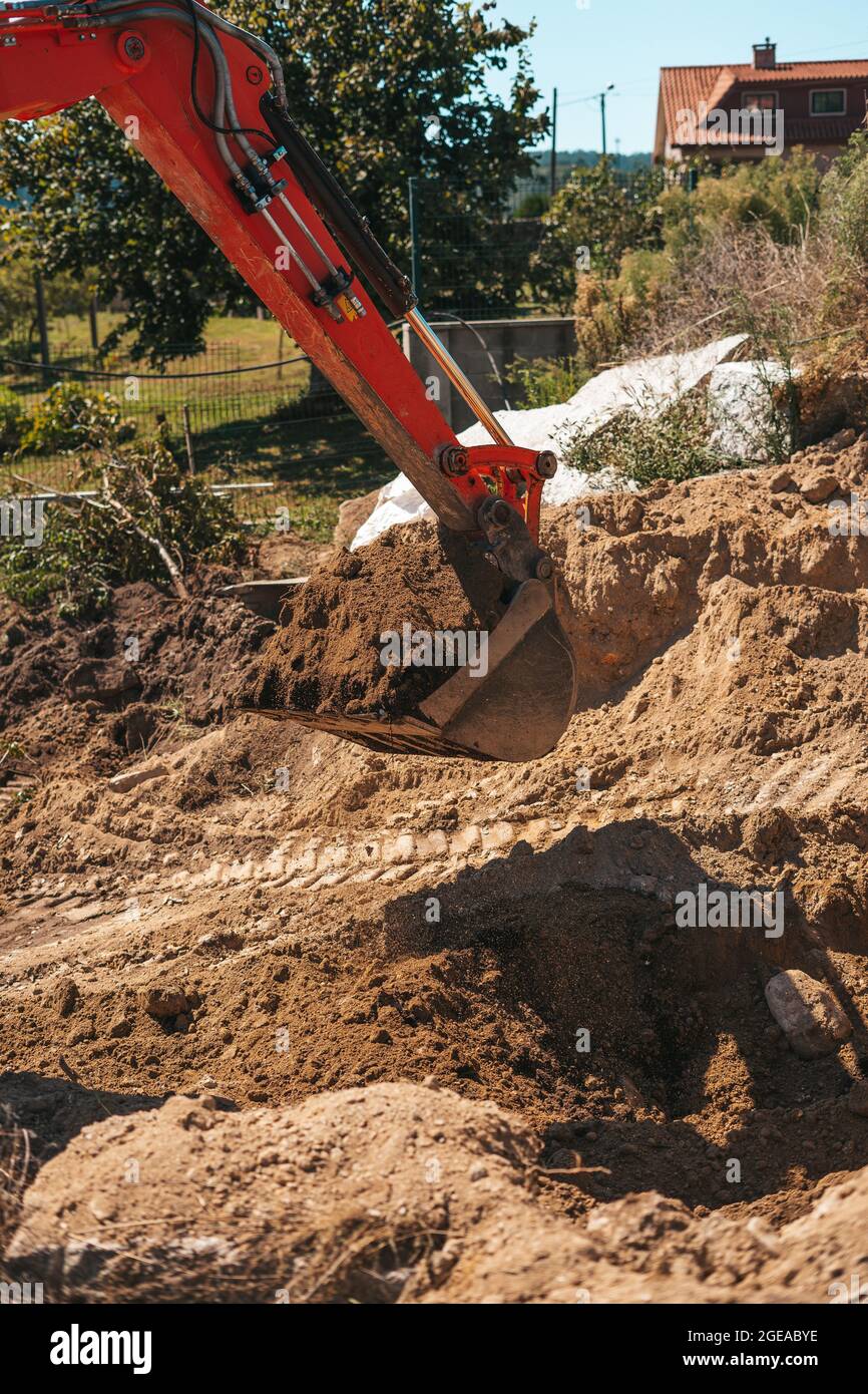 Excavator shovel digging on dirt on a construction site Stock Photo - Alamy