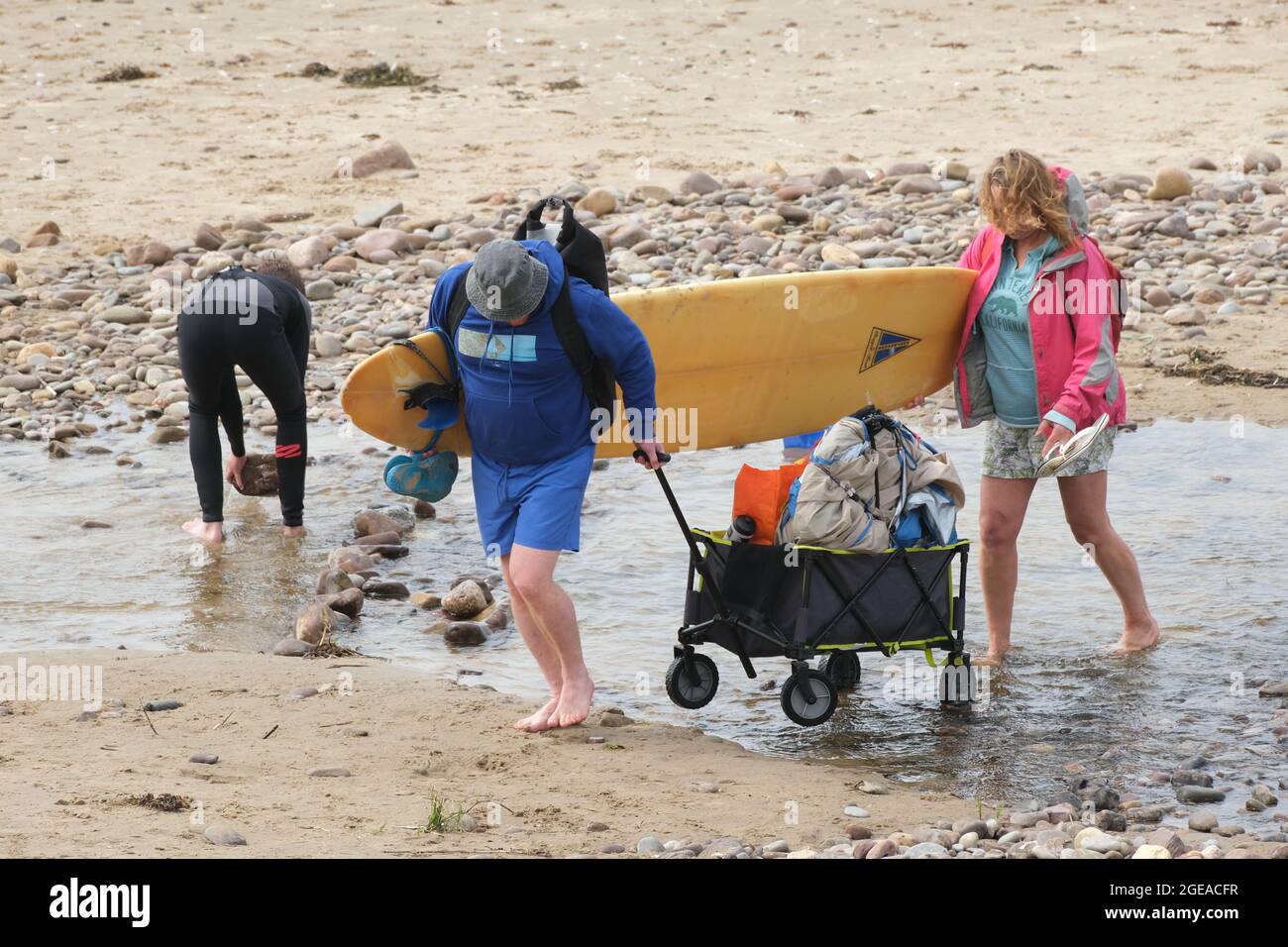 Gower, Swansea, UK. 17th August, 2021. Beachgoers make the best of ...