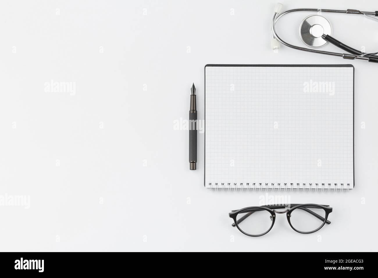 Notebook with stethoscope and glasses Stock Photo - Alamy