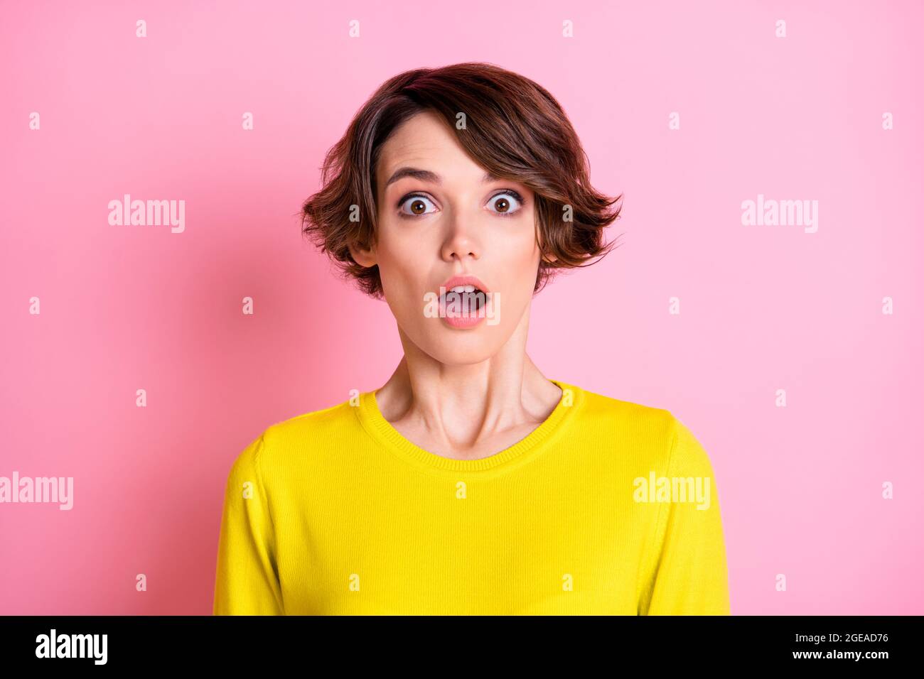 Portrait of attractive worried amazed brown-haired girl sudden news ...