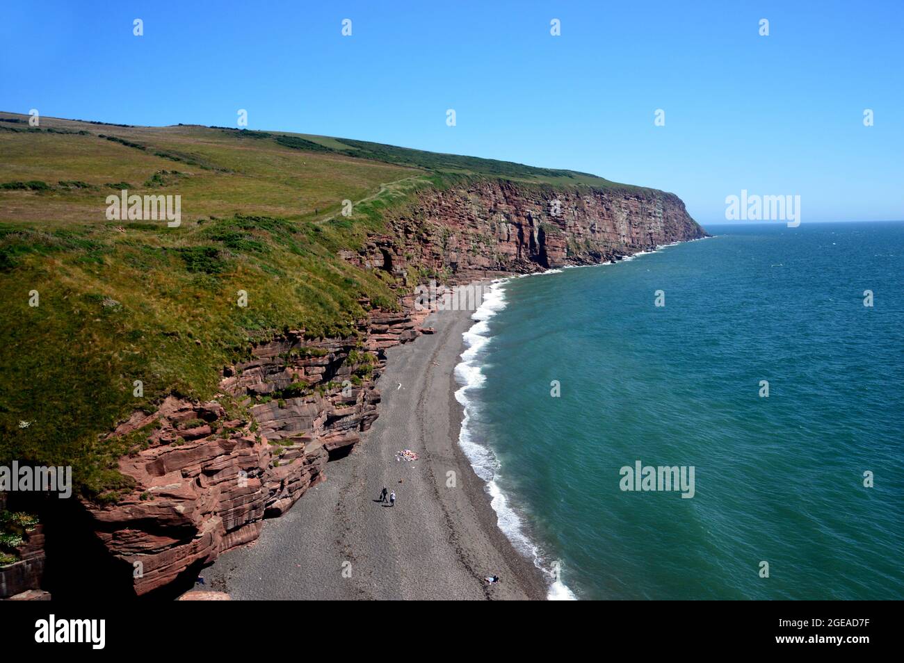 The Red Sandstone Cliffs at Fleswick Bay on the Clifftop Coastal Path ...