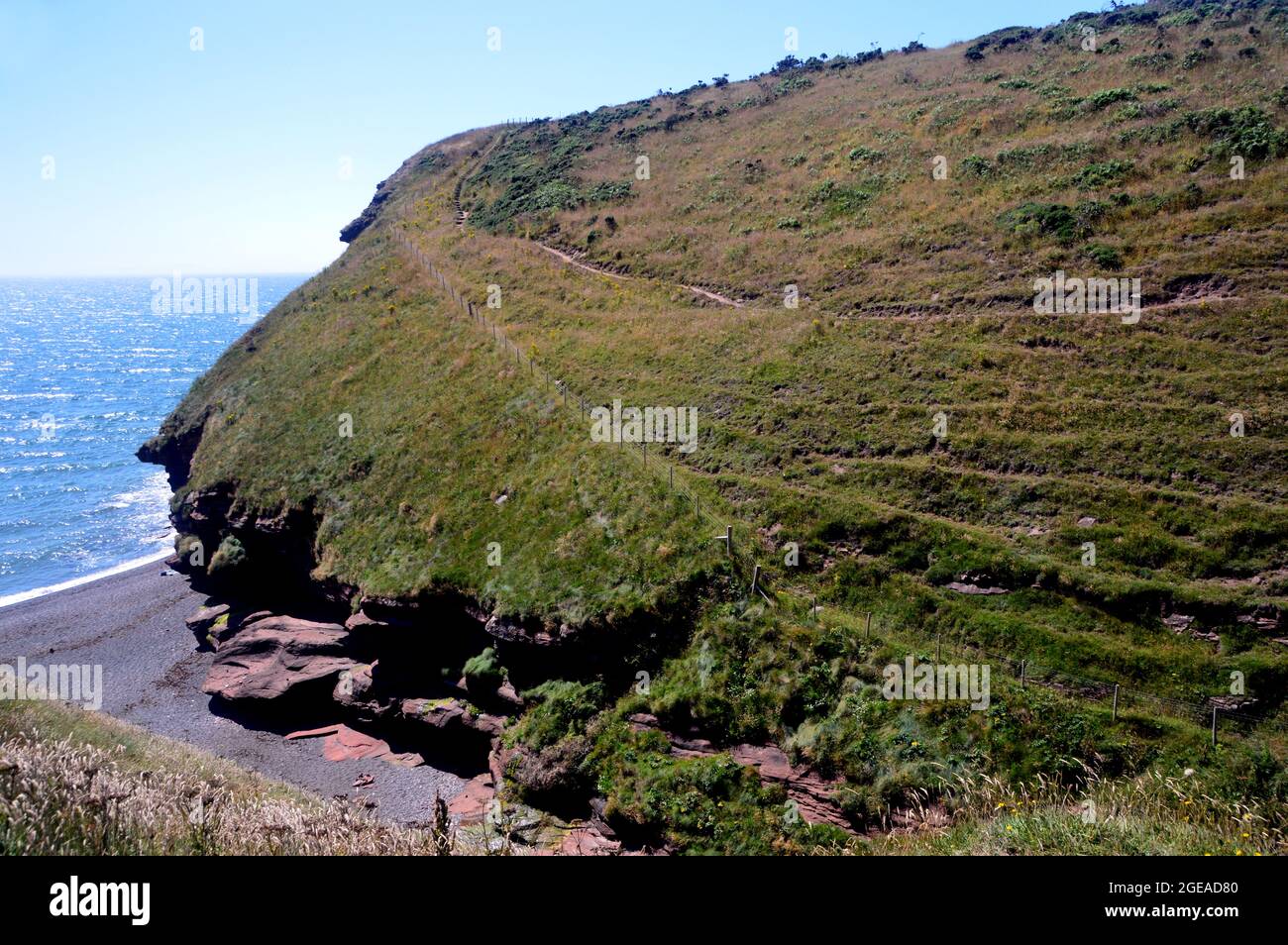 The Red Sandstone Cliffs at Fleswick Bay on the Clifftop Coastal Path ...