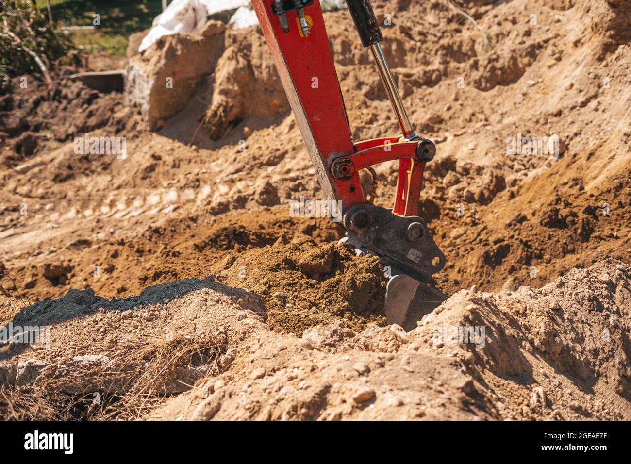 Excavator shovel digging on dirt on a construction site Stock Photo - Alamy