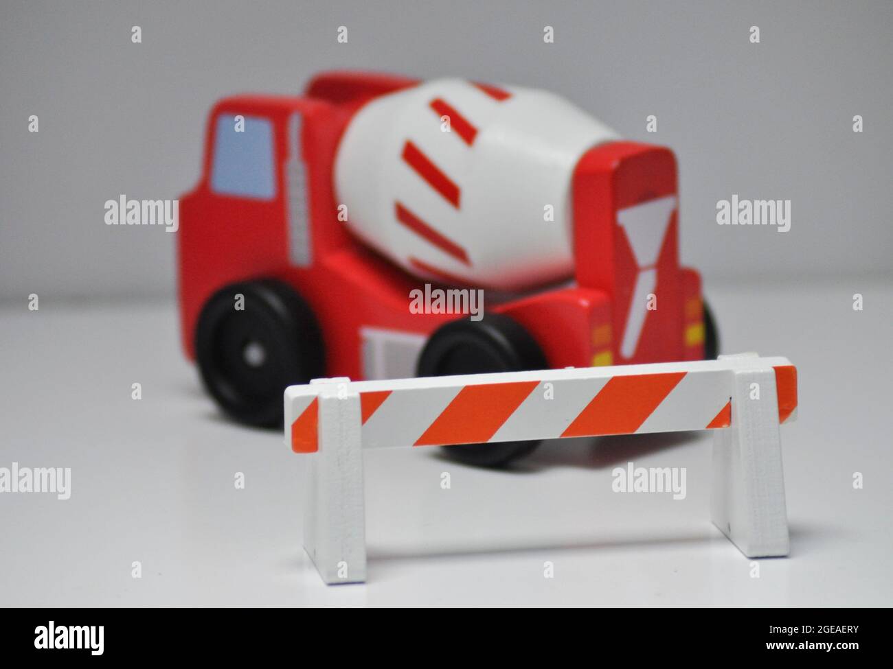 Red lorry with white cement mixer and a wooden bollard - wooden ...