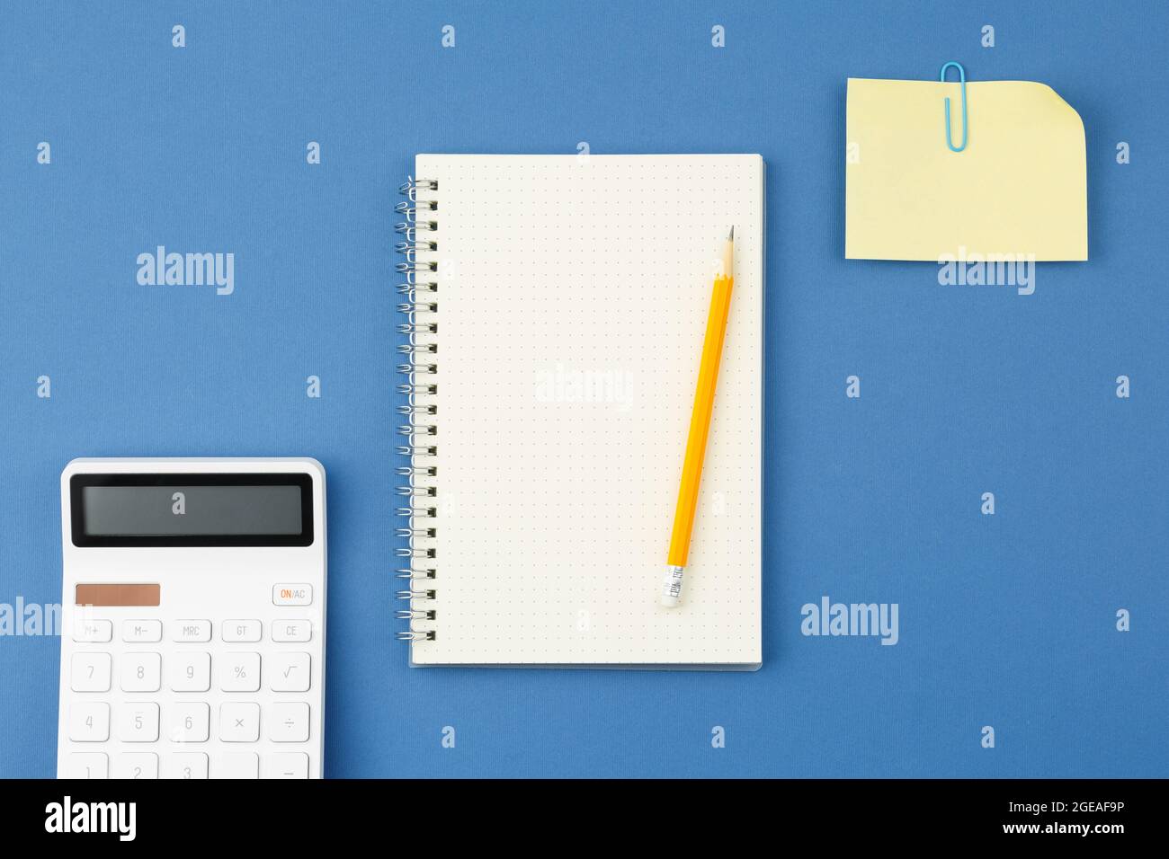 Notepad, pencil, calculator, note sheet Stock Photo - Alamy