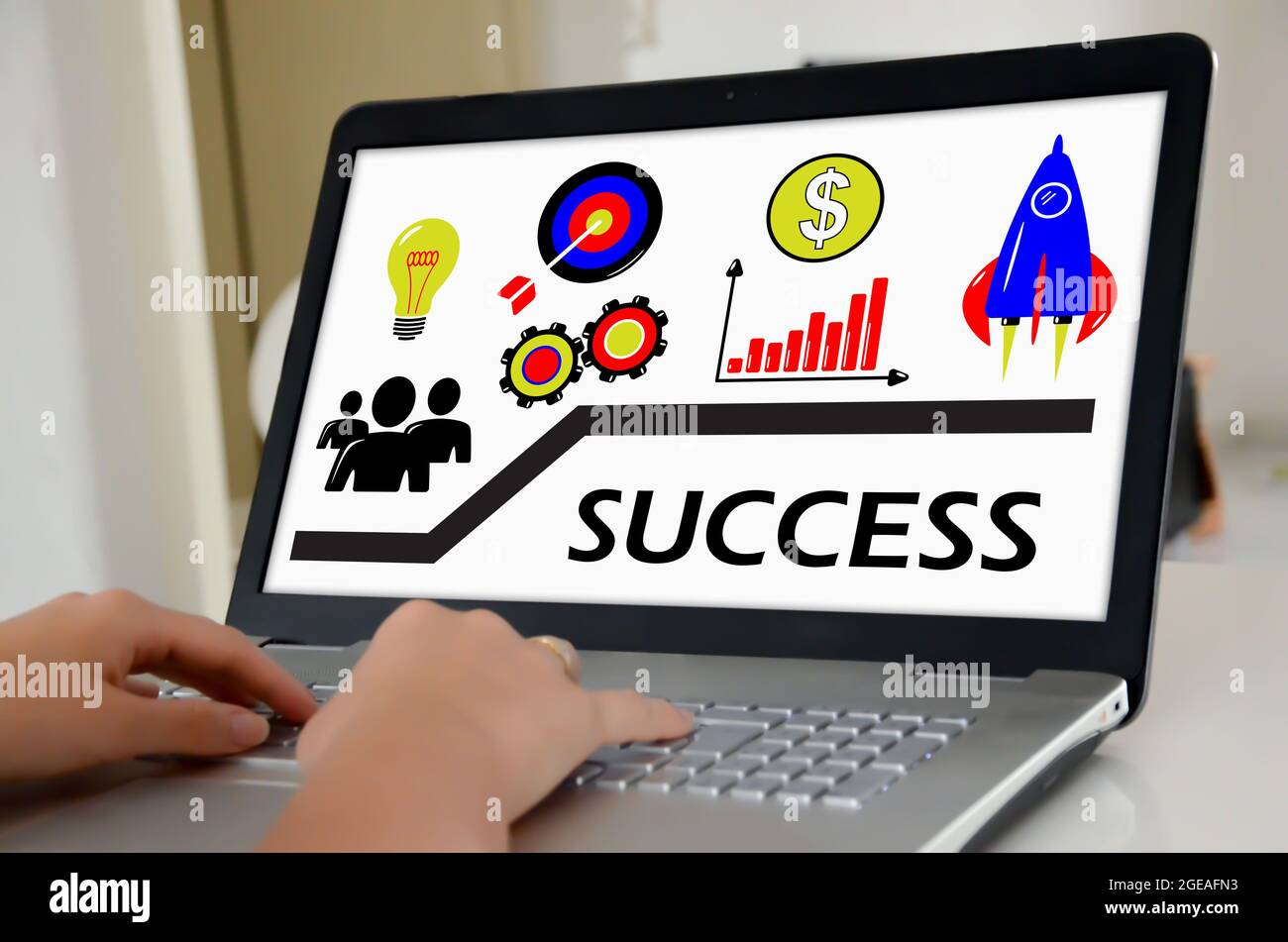 Hands on a laptop with screen showing success concept Stock Photo - Alamy