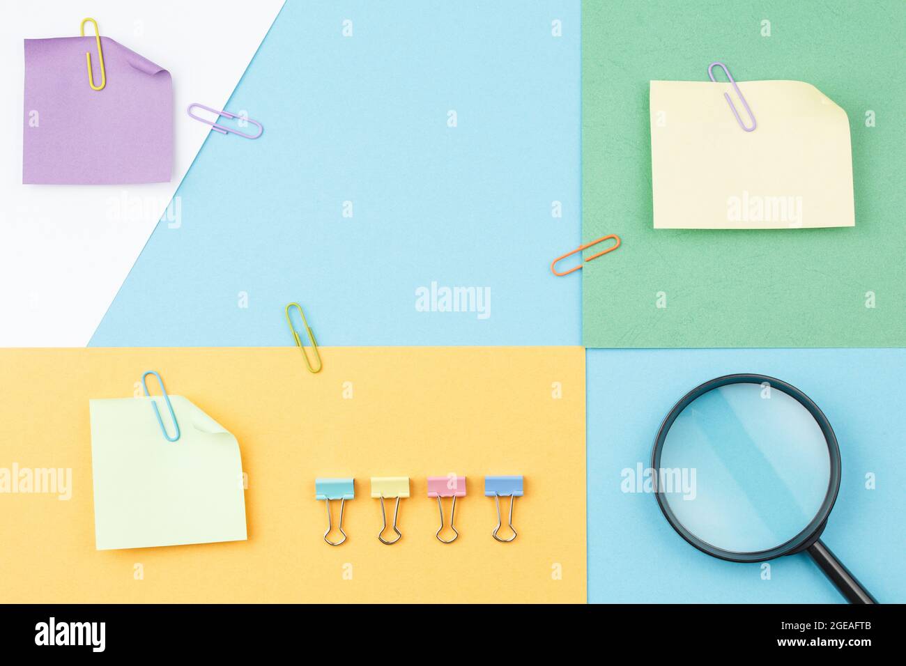 Colored paper with binders and note paper Stock Photo - Alamy