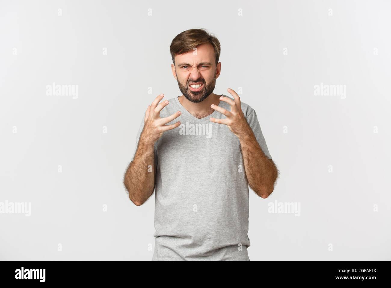 Portrait of angry bearded man, shouting and shaking hands frustrated ...