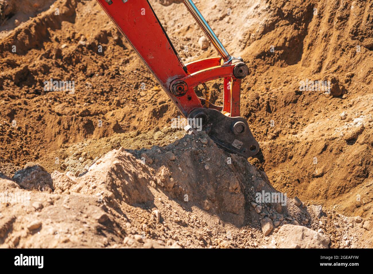 Excavator shovel digging on dirt on a construction site Stock Photo - Alamy