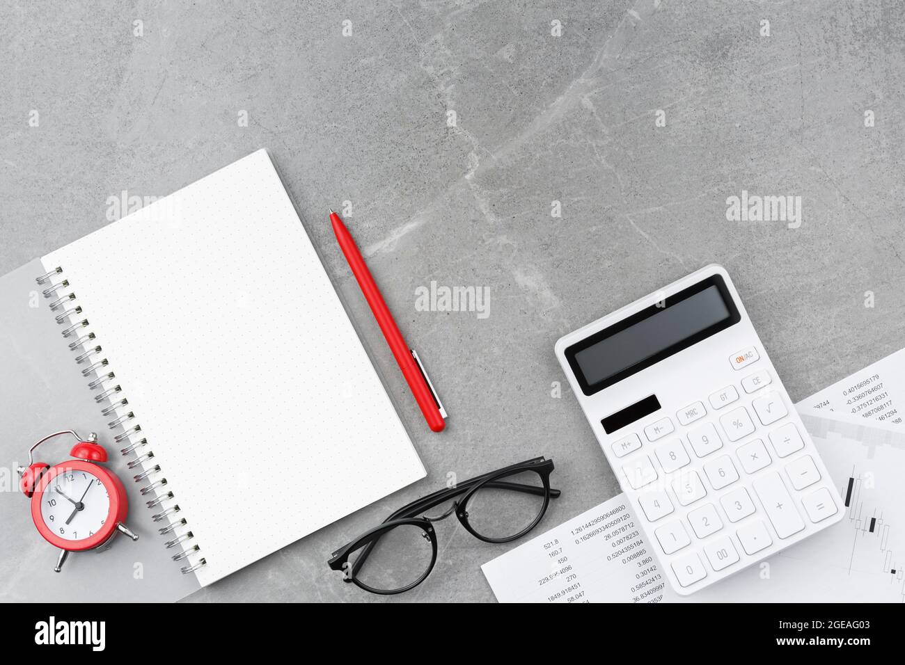 Open notebook on gray marble background Stock Photo - Alamy