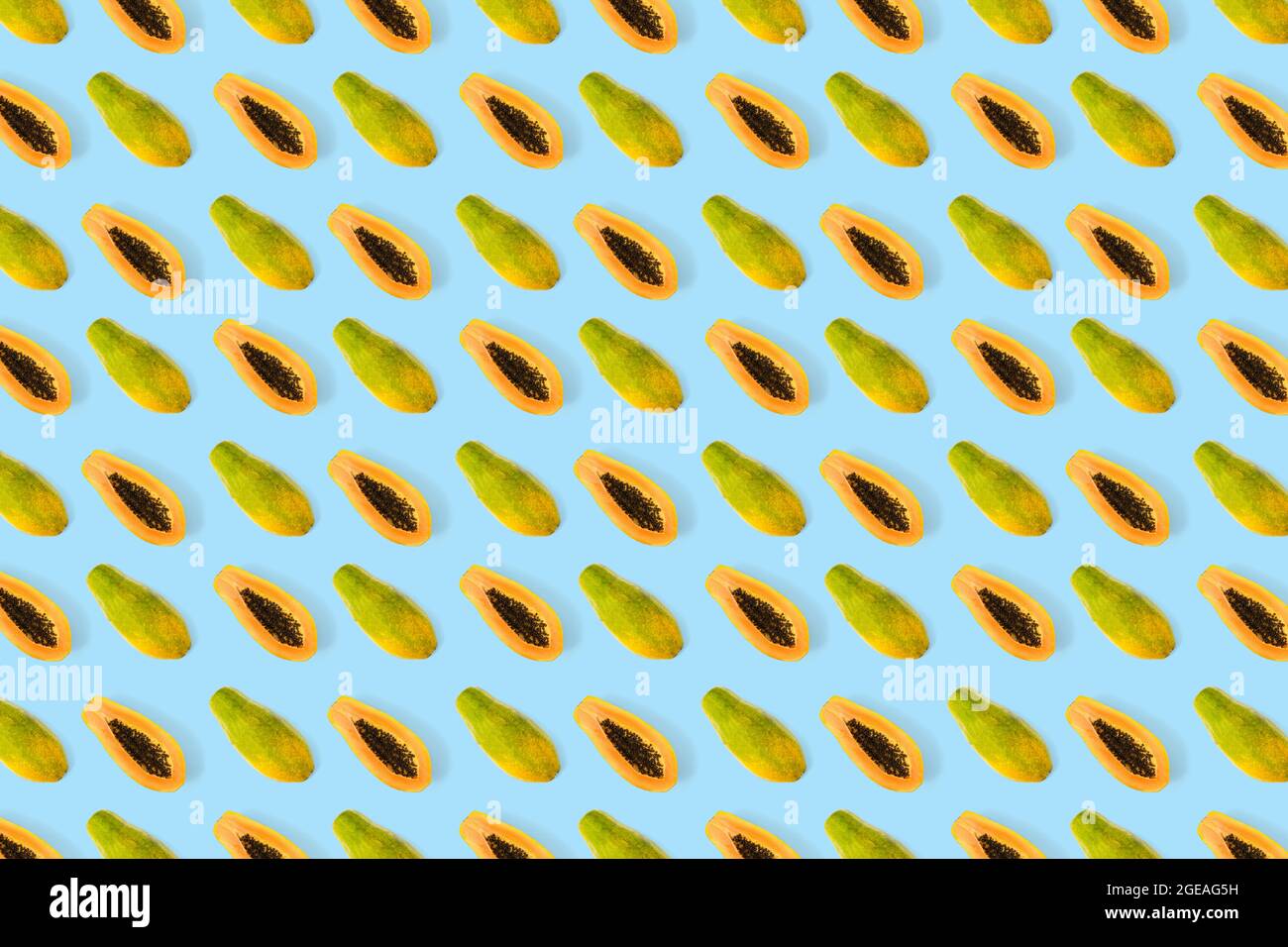 Fresh ripe papaya background on blue backdrop. Tropical abstract ...