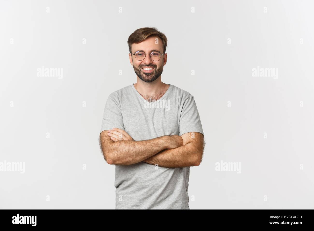 Image of confident handsome man in gray t-shirt and glasses, cross arms ...