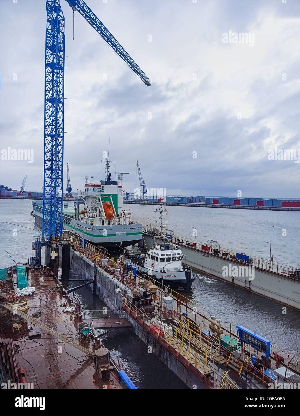 07.31.2021 Netherlands, Delfdzijl Towing a transport vessel by tug for ...