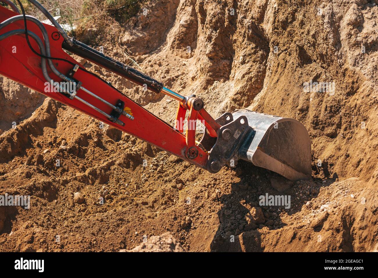 Excavator shovel digging on dirt on a construction site Stock Photo - Alamy