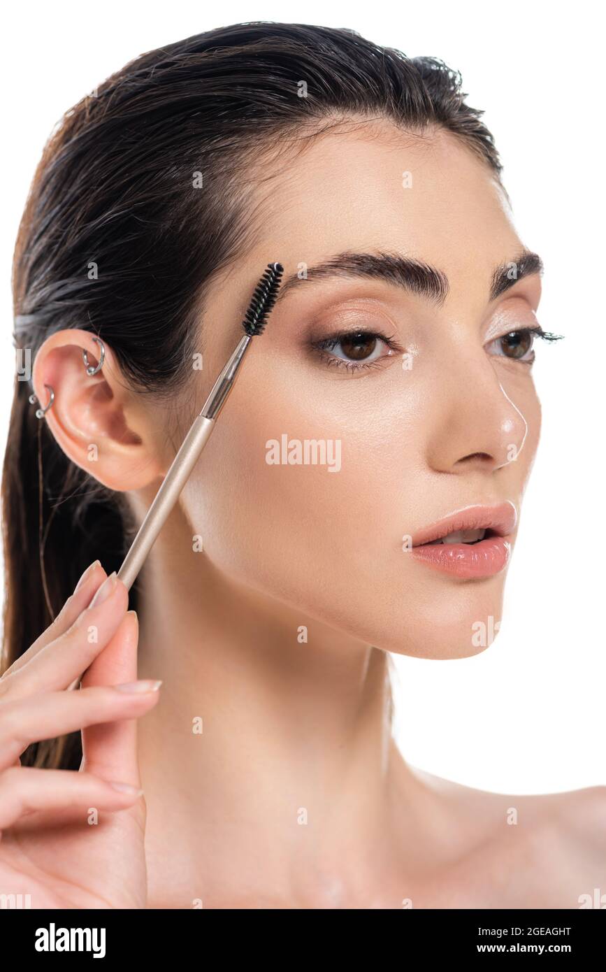brunette young woman styling eyebrow isolated on white Stock Photo - Alamy