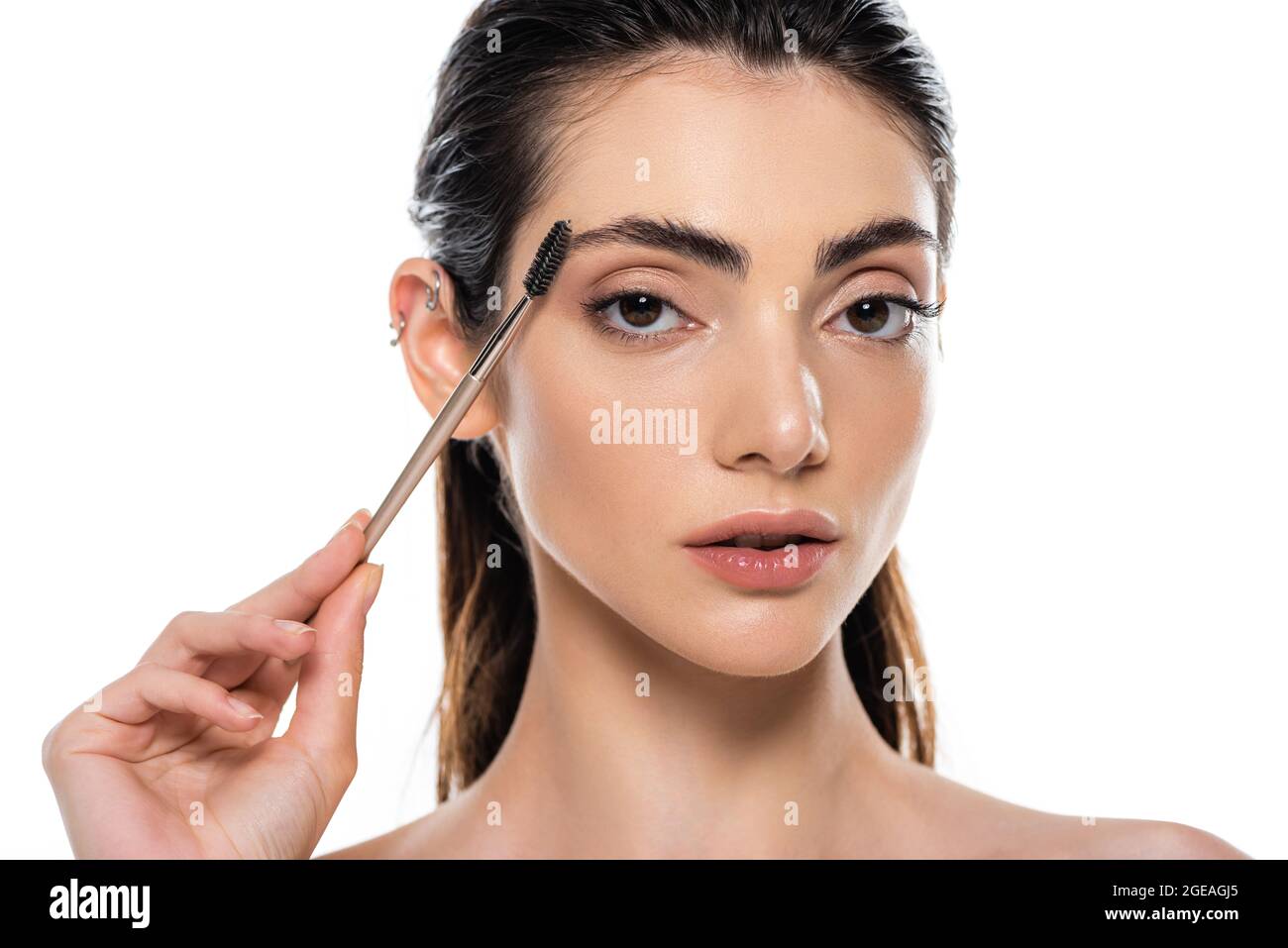 Young woman brushing eyebrows hi-res stock photography and images - Alamy