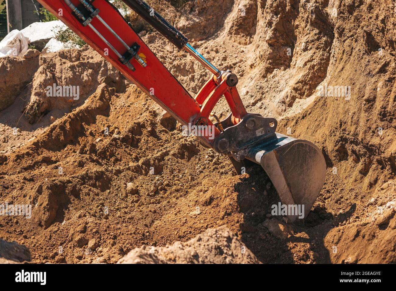Excavator shovel digging on dirt on a construction site Stock Photo - Alamy