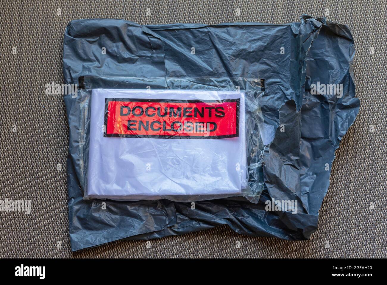 Documents Enclosed Red Sign at Package Mail Stock Photo - Alamy