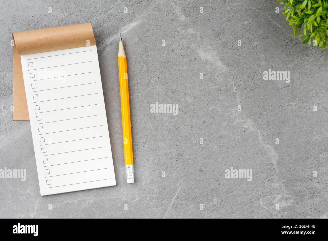 Open notebook on gray marble background Stock Photo - Alamy
