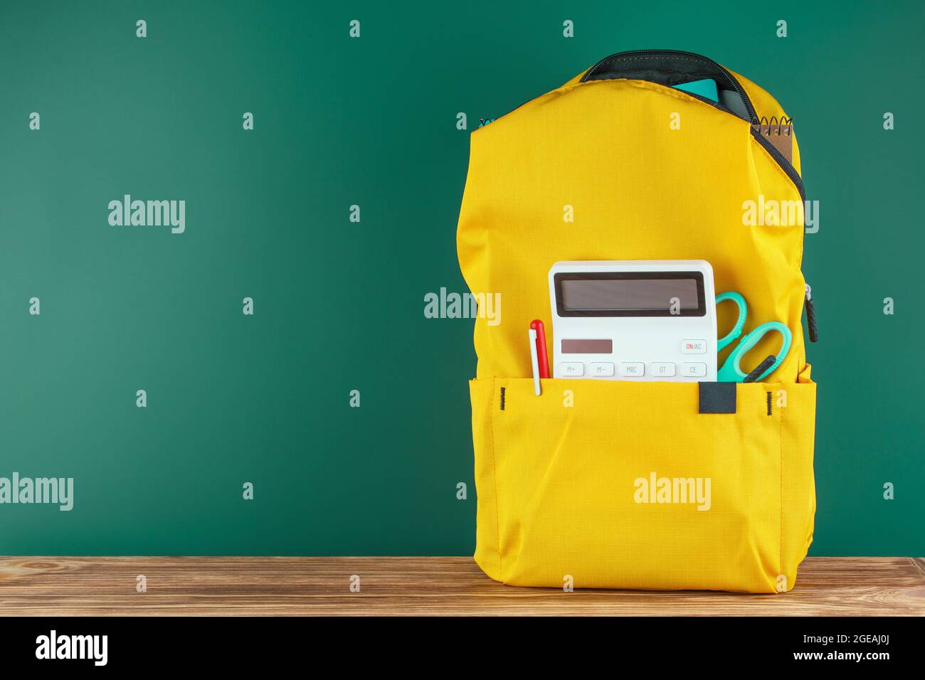 Backpack on the desk in the classroom Stock Photo - Alamy