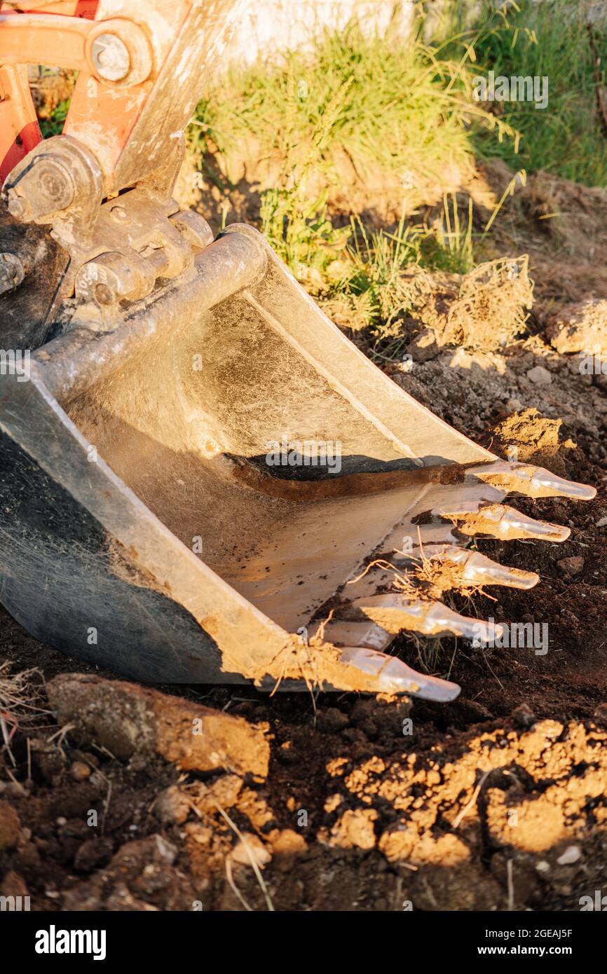 Detail of the shovel on a backhoe excavator on a construction site ...