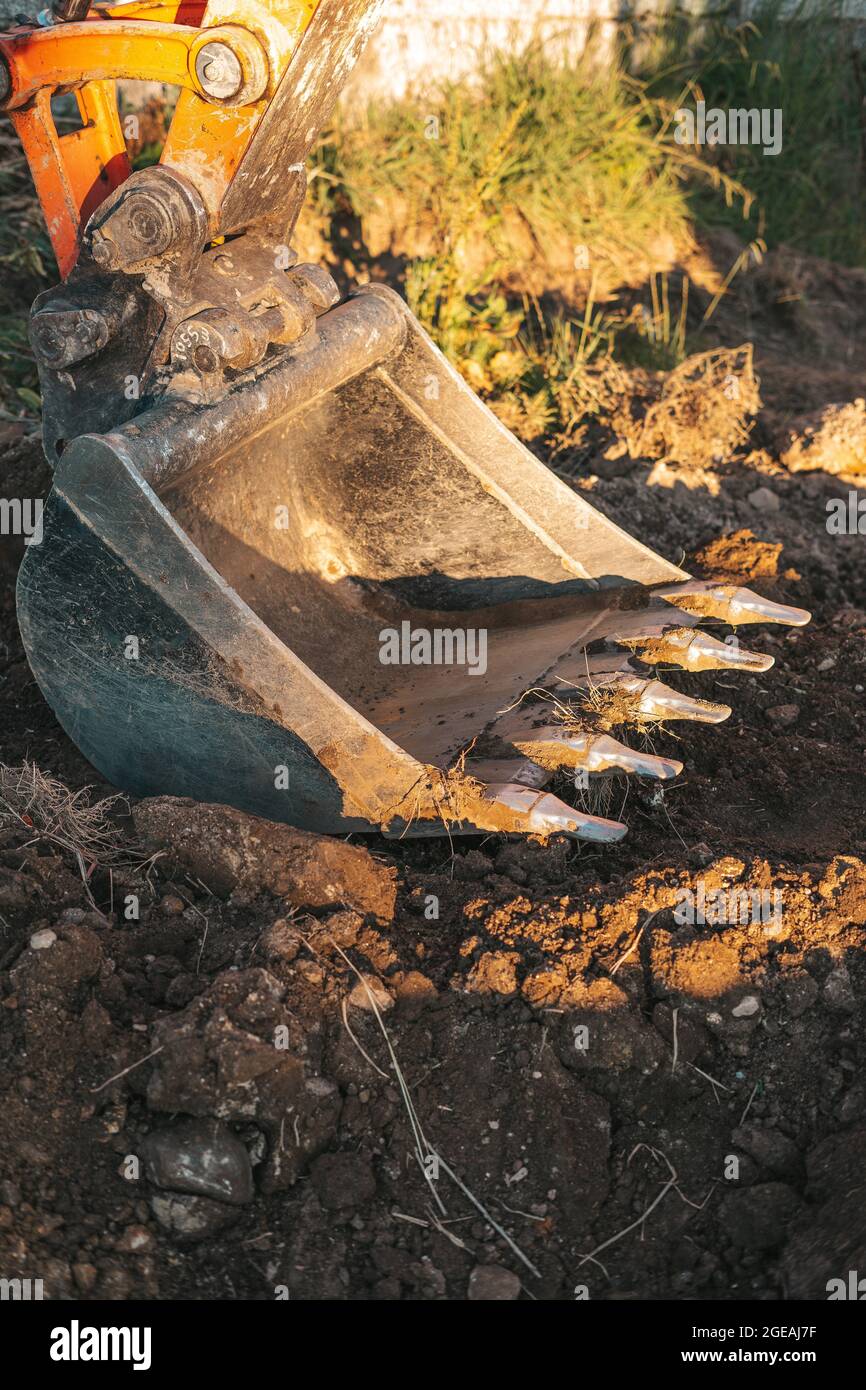 Detail of the shovel on a backhoe excavator on a construction site ...