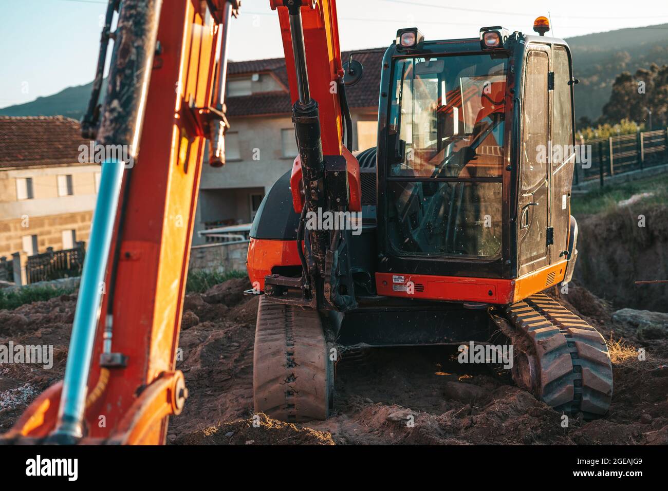 Backhoe excavator on a construction site over dirt Stock Photo - Alamy