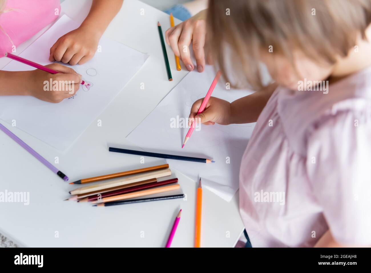 high angle view of kids drawing near kindergarten teacher Stock Photo ...