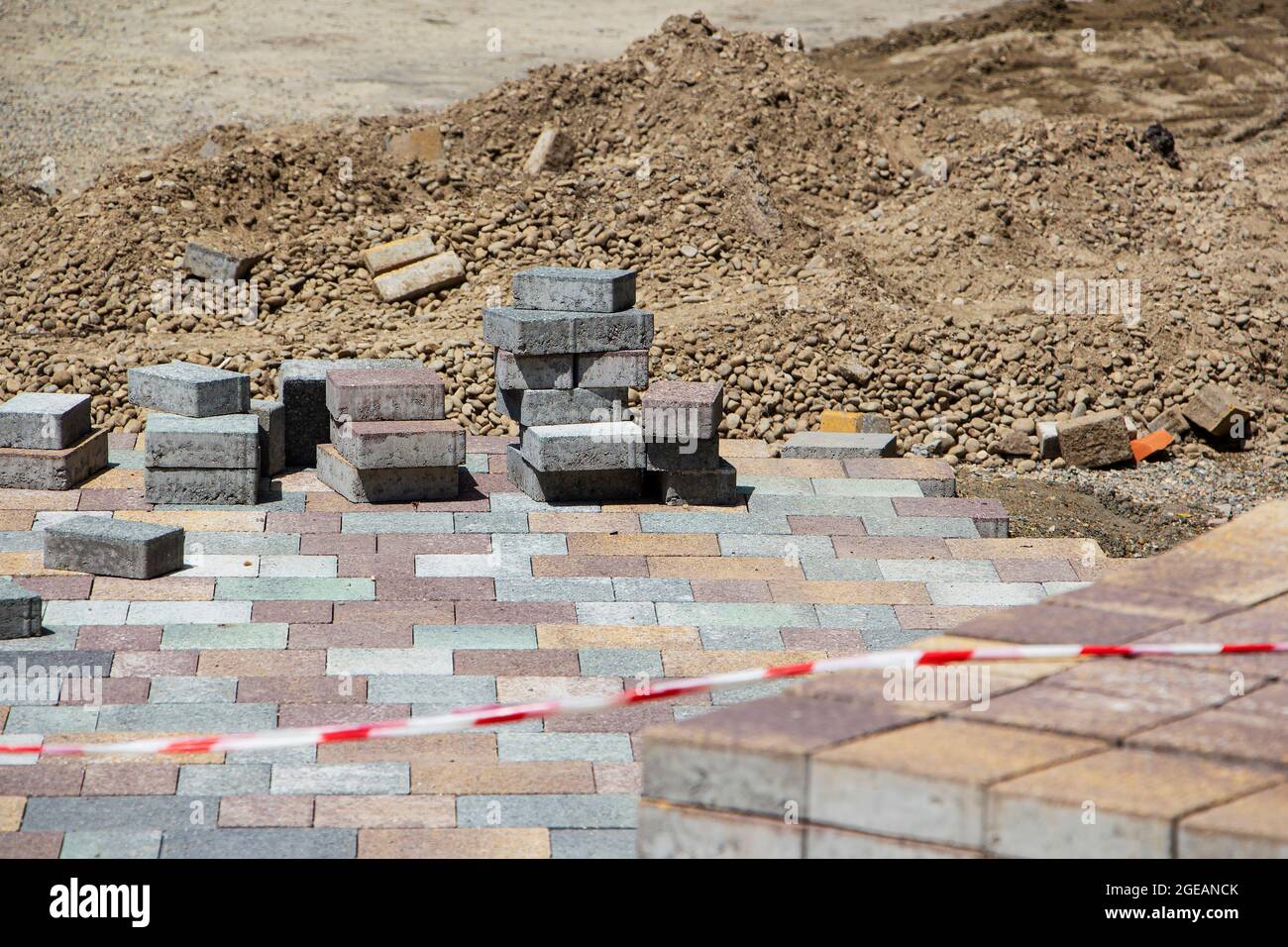Process of construction of brick paved sidewalk, half built pavement ...