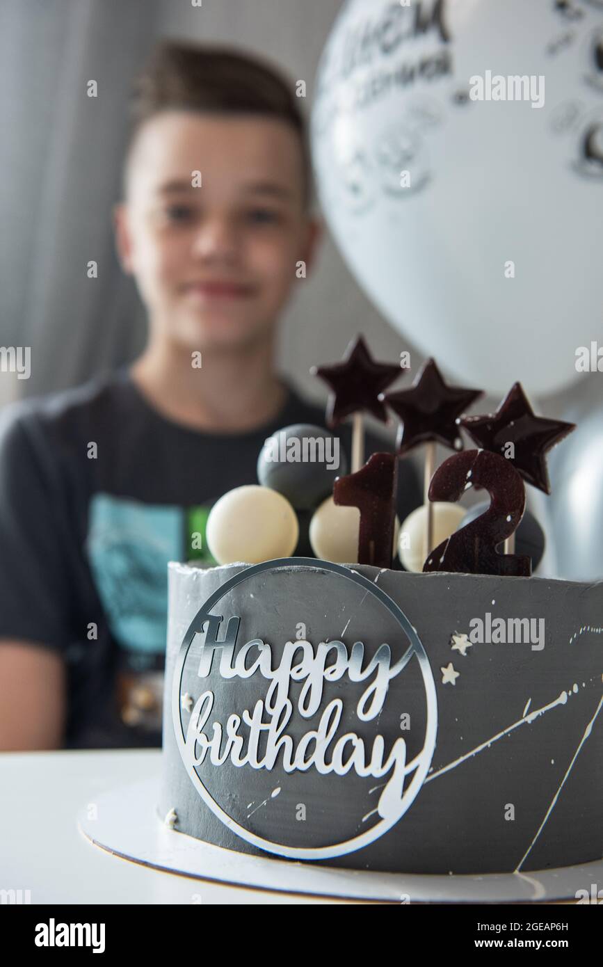 Young boy happy birthday celebrating 12 years Stock Photo - Alamy