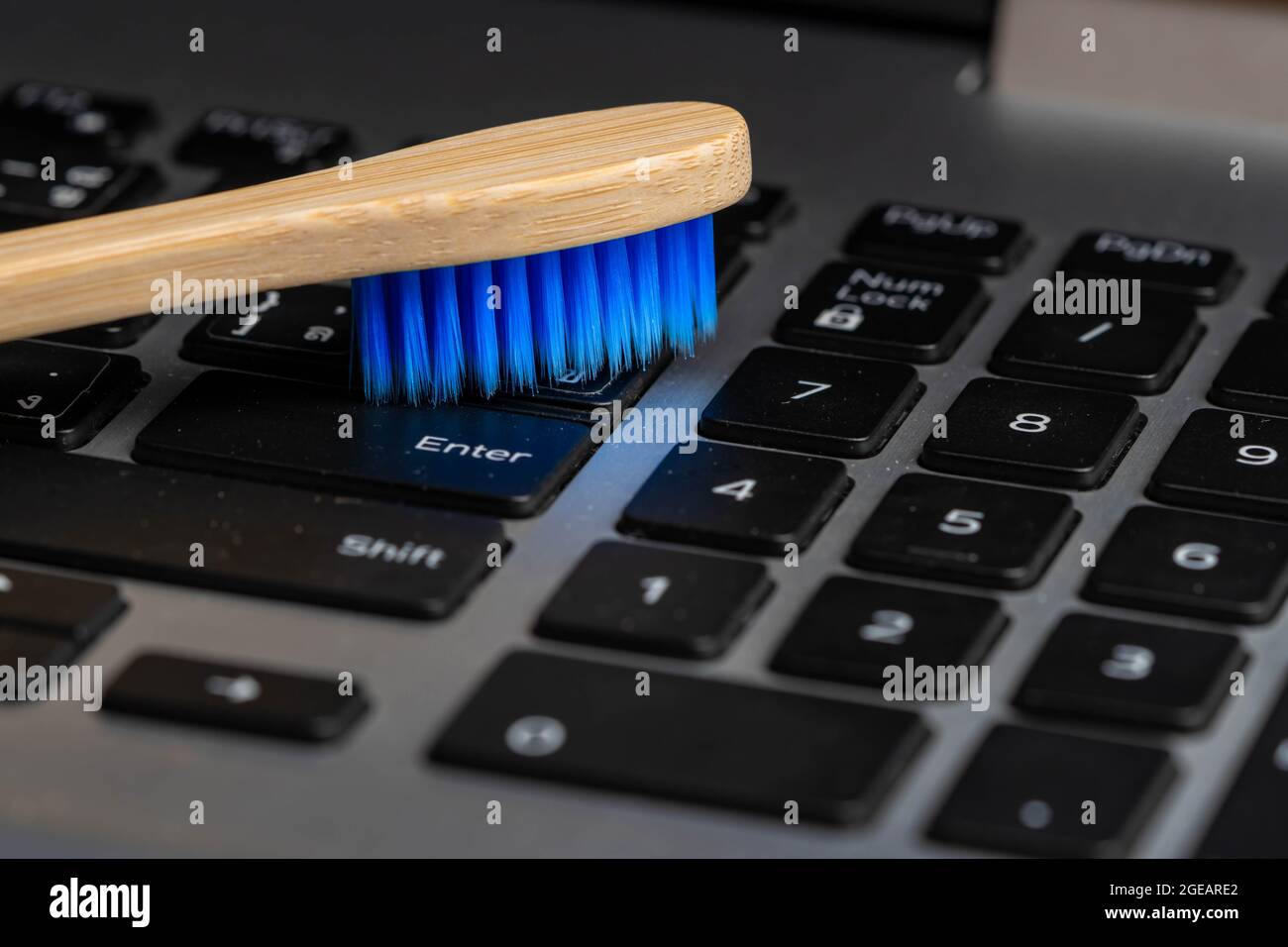 Closeup to colorful of Toothbrush wooden handle Cleaning the keyboard ...