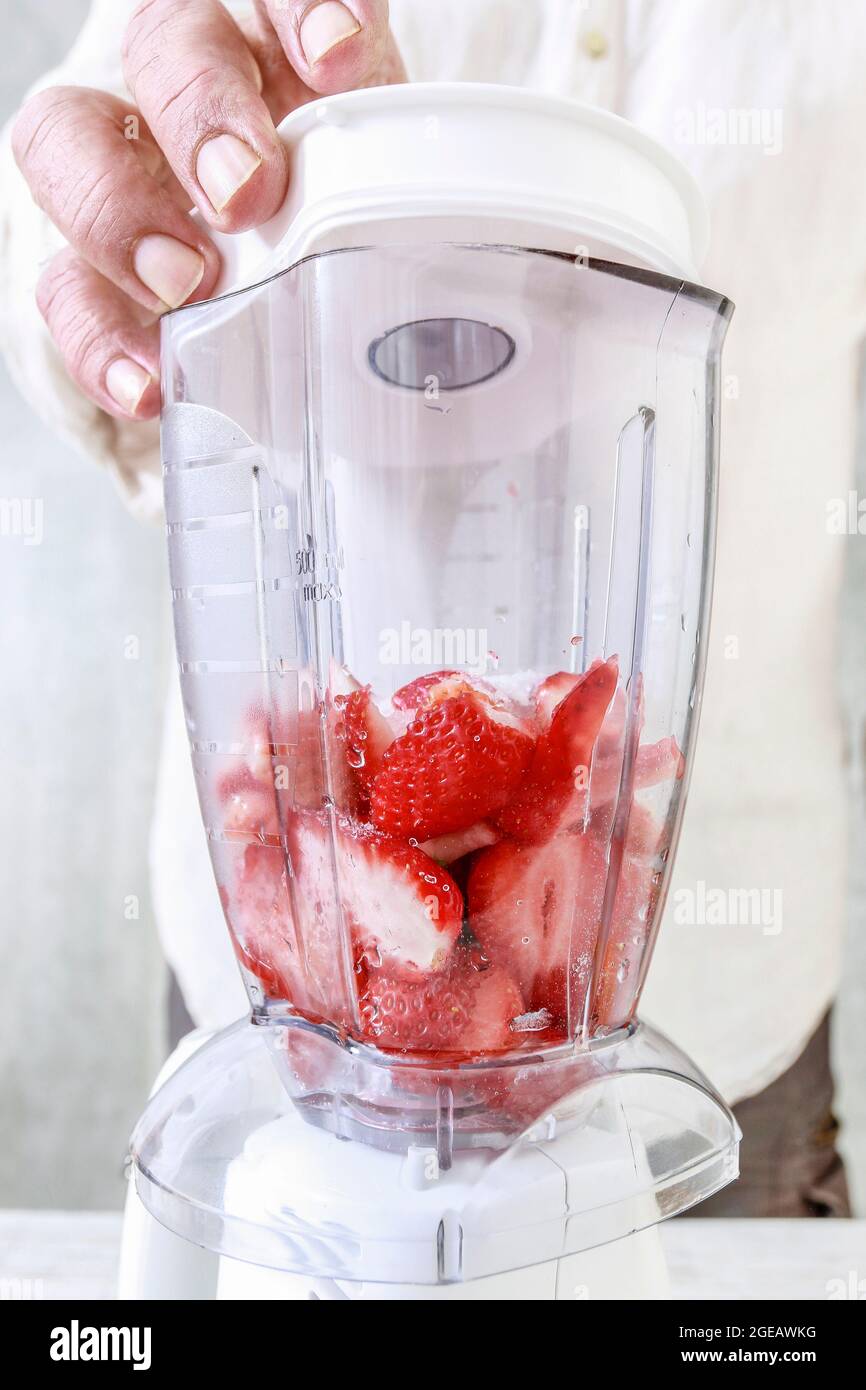 How to make fruit smoothie using blender. Step by step, tutorial Stock ...