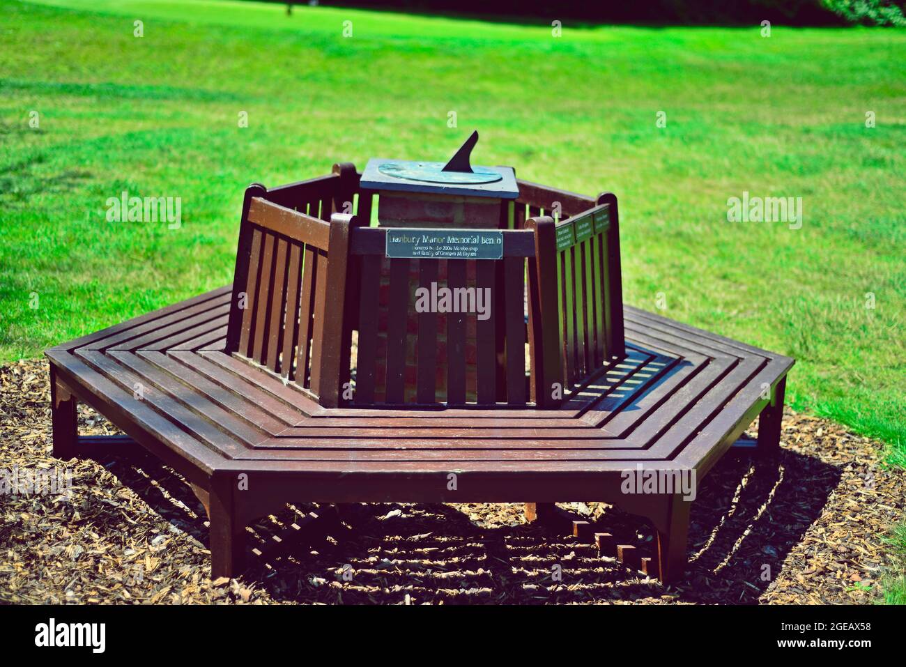 Hexagonal bench at Hanbury Manor Stock Photo - Alamy
