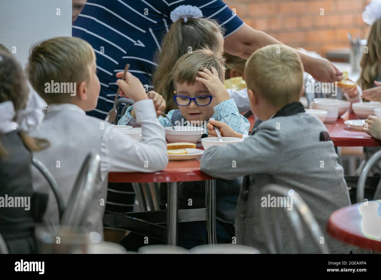 First graders eat in the school cafeteria. Lunch in the dining room on ...