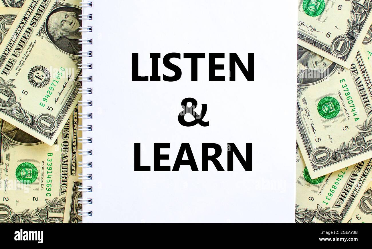 Listen and learn symbol. Words 'Listen and learn' on white note ...