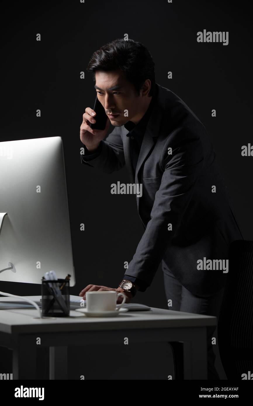 Successful Chinese businessman working Stock Photo - Alamy