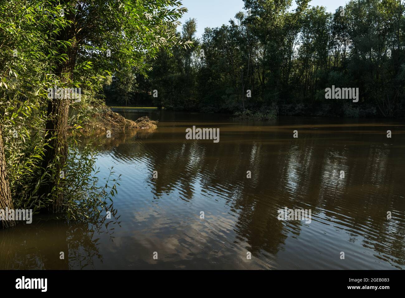 View over the smooth surface of a lake Stock Photo - Alamy