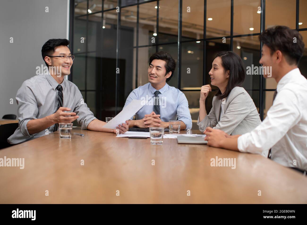 Chinese business people talking in meeting room Stock Photo - Alamy