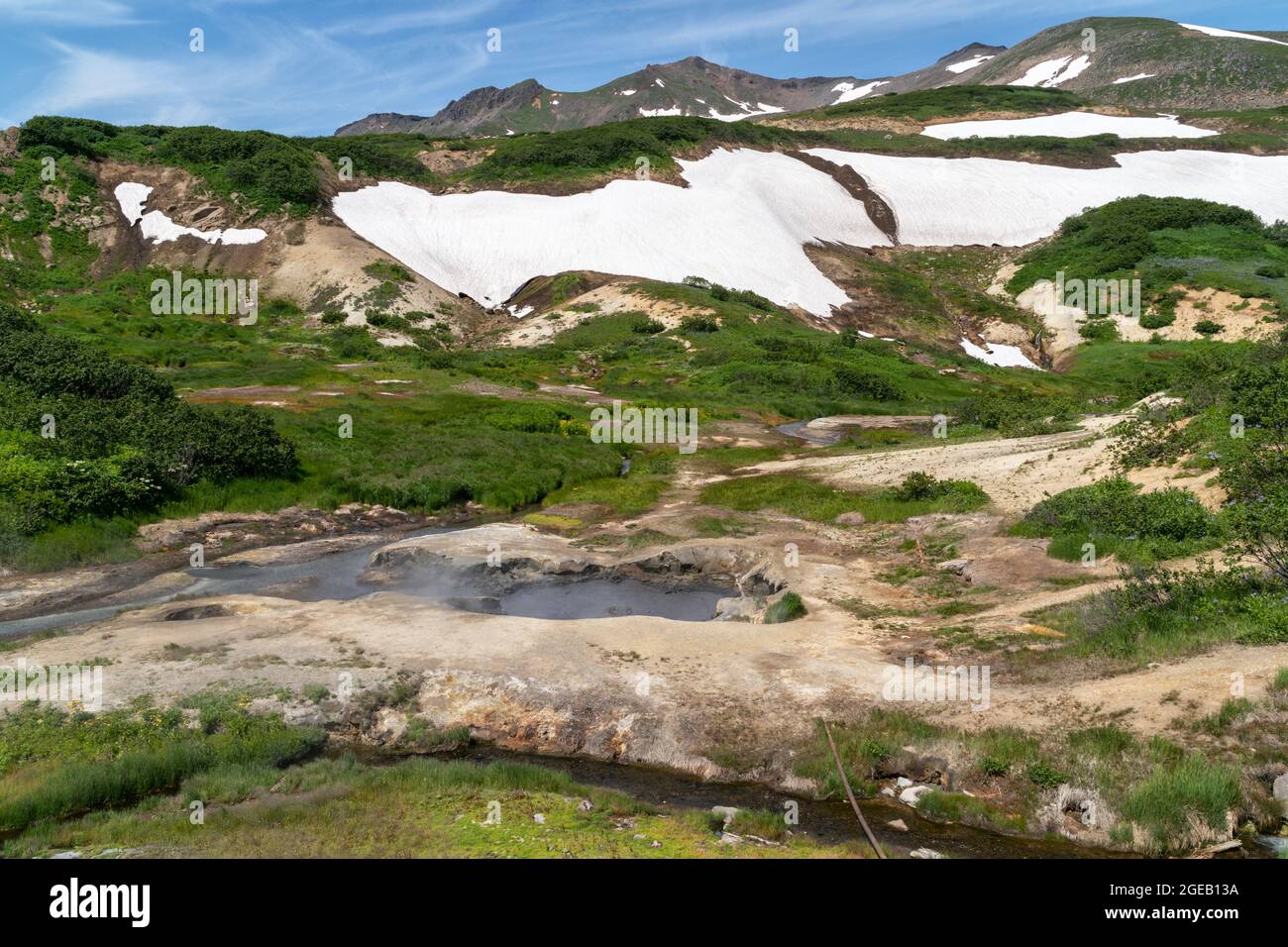 Hot natural thermal water springs in a mountain valley in Kamchatka ...