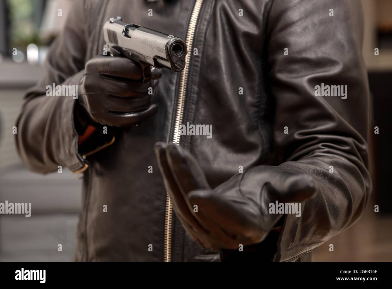 Man with gun leather jacket hi-res stock photography and images - Alamy