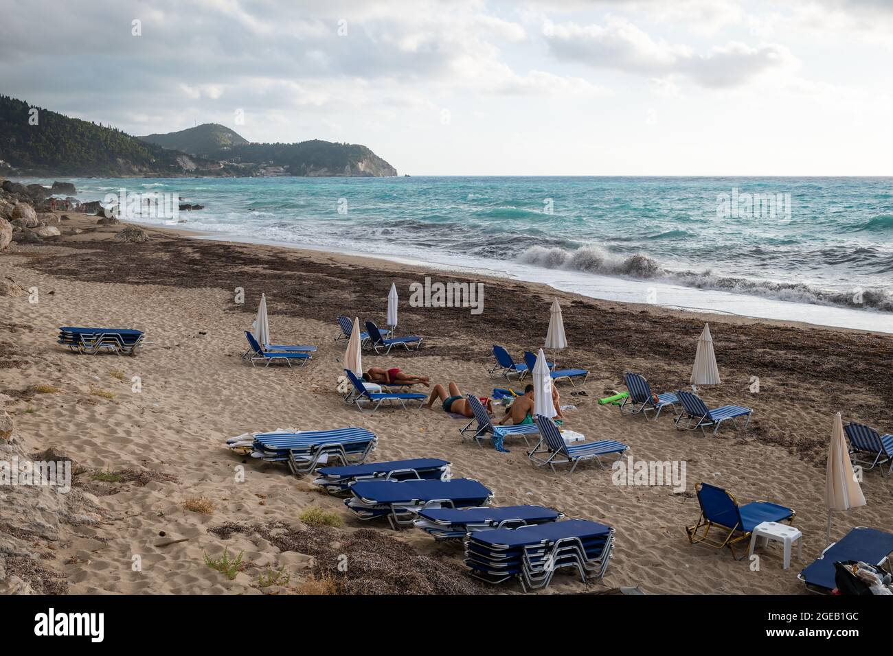 A beautiful long sandy beach with sun beds and umbrellas for tourism ...