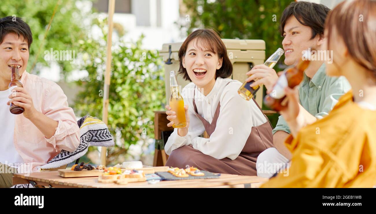 Japanese friends having a party in the garden Stock Photo - Alamy