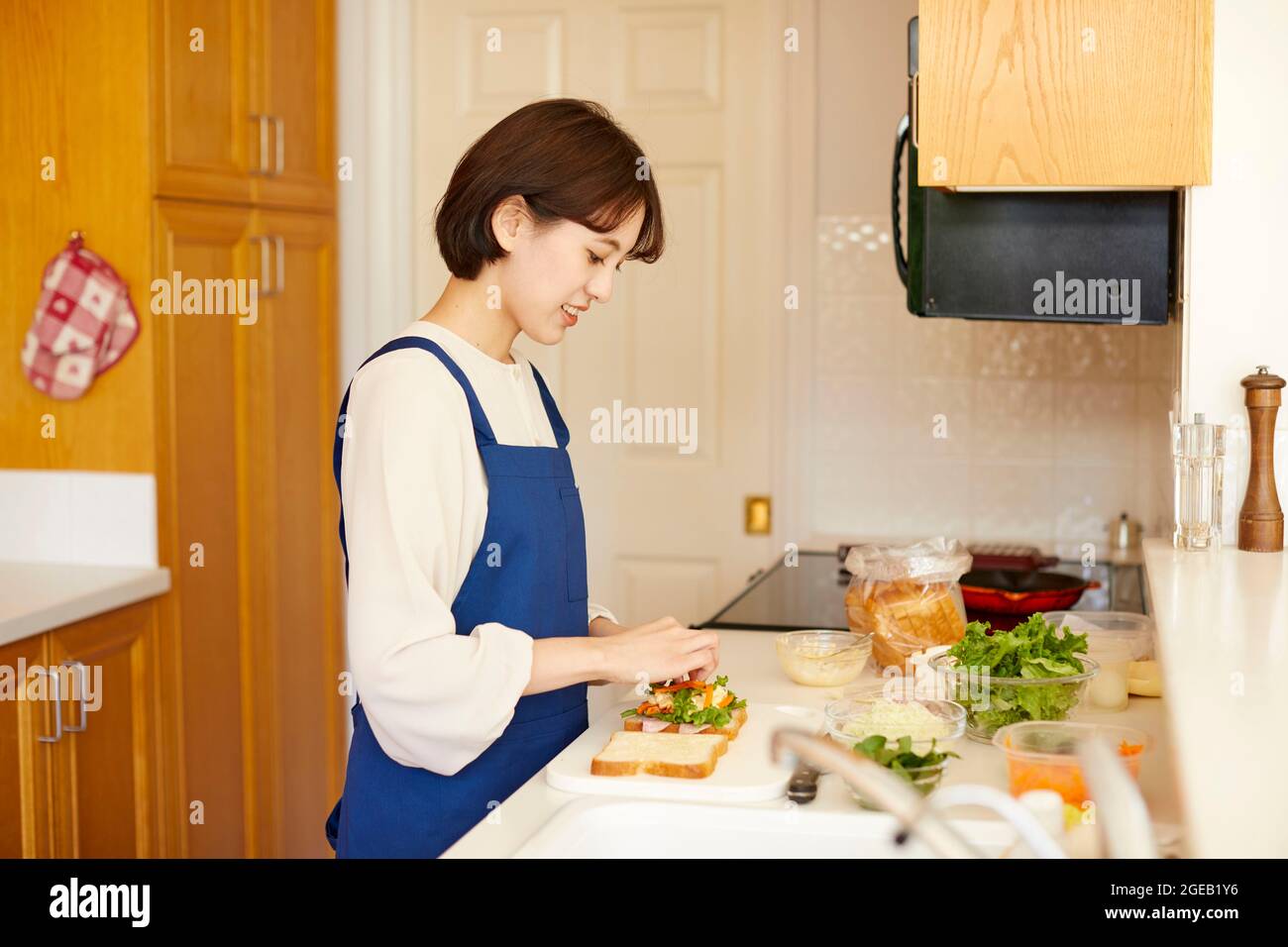Japanese woman cooking at home Stock Photo - Alamy