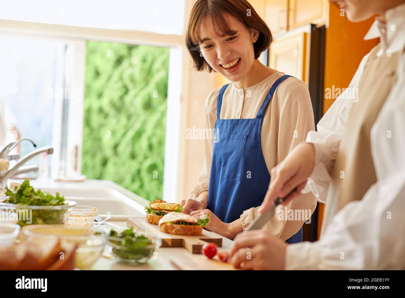 Japanese friends cooking at home Stock Photo - Alamy