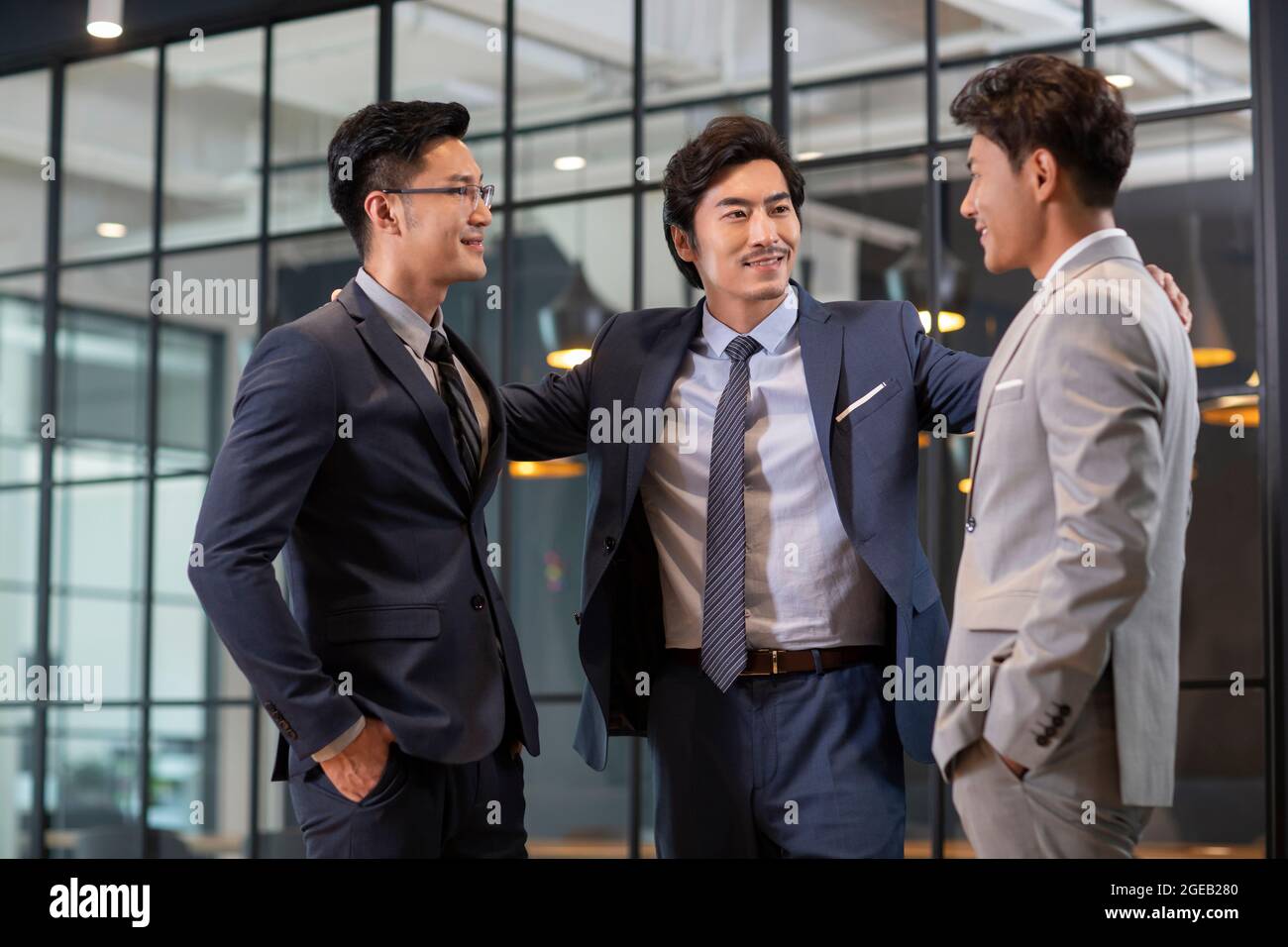 Smiling chinese businessmen in hi-res stock photography and images - Alamy