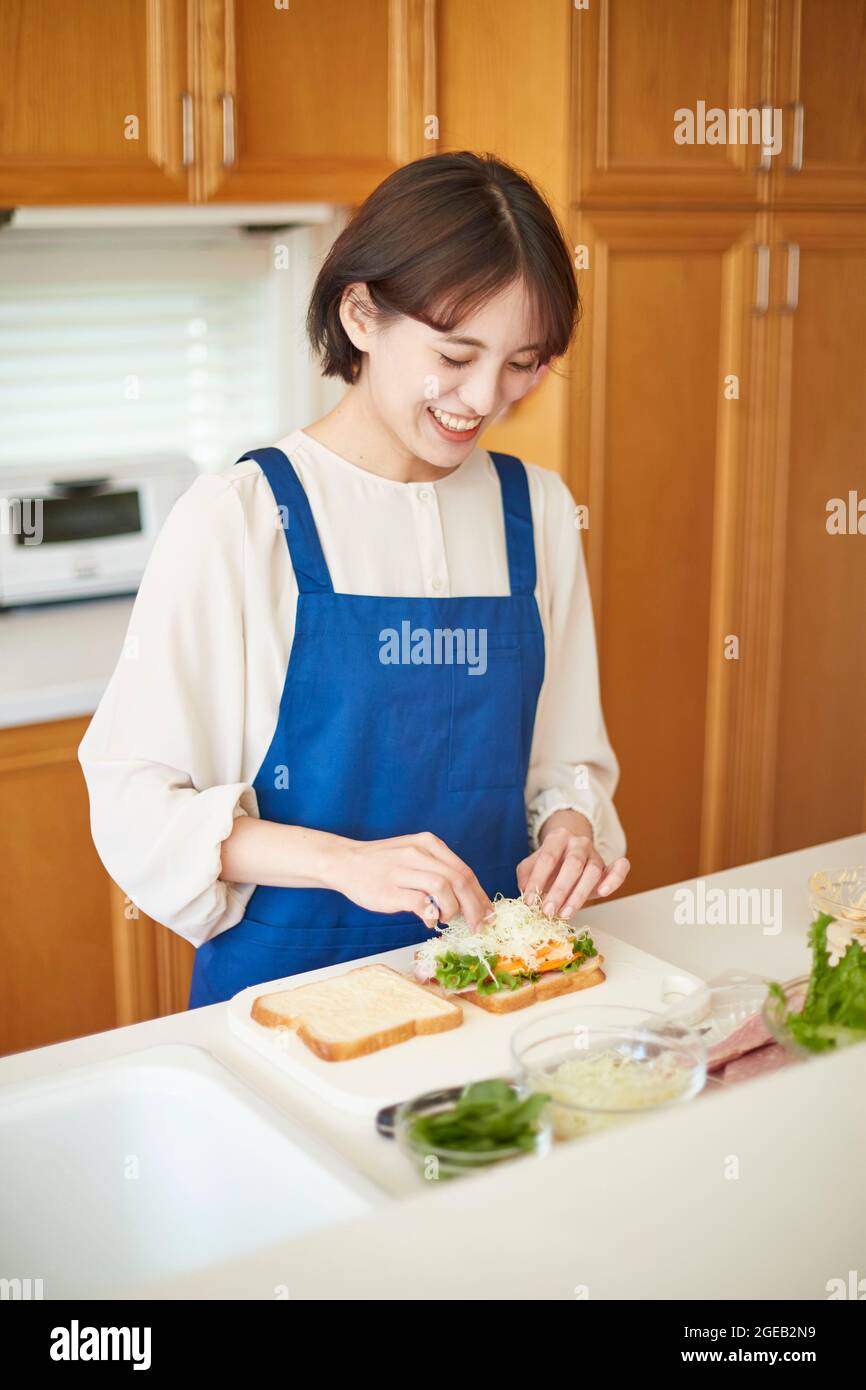 Japanese woman cooking at home Stock Photo - Alamy