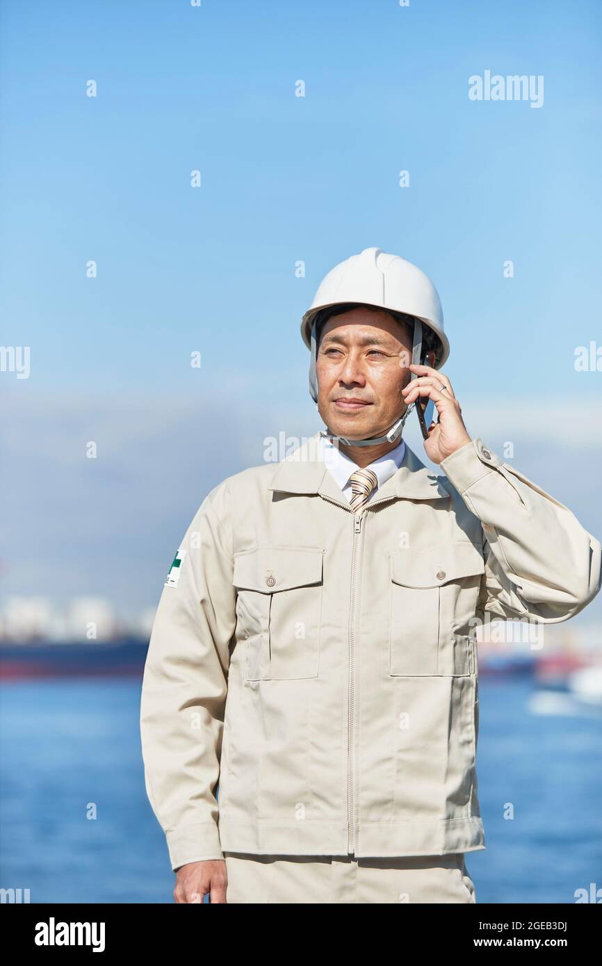 Japanese worker outside Stock Photo - Alamy