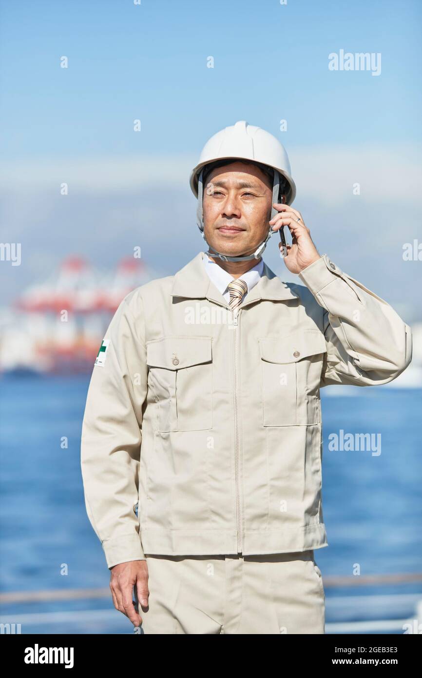 Japanese worker outside Stock Photo - Alamy