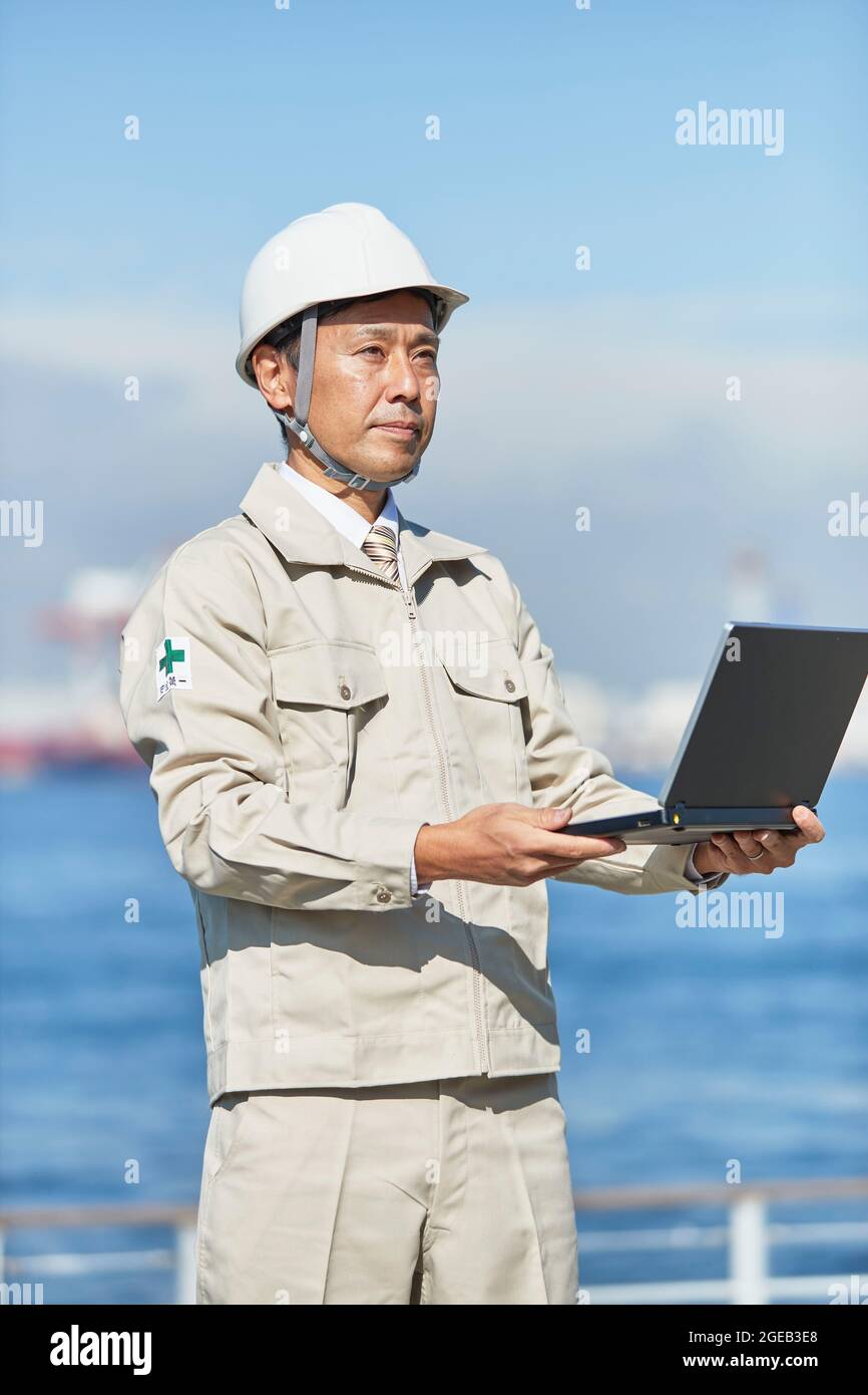 Japanese worker outside Stock Photo - Alamy